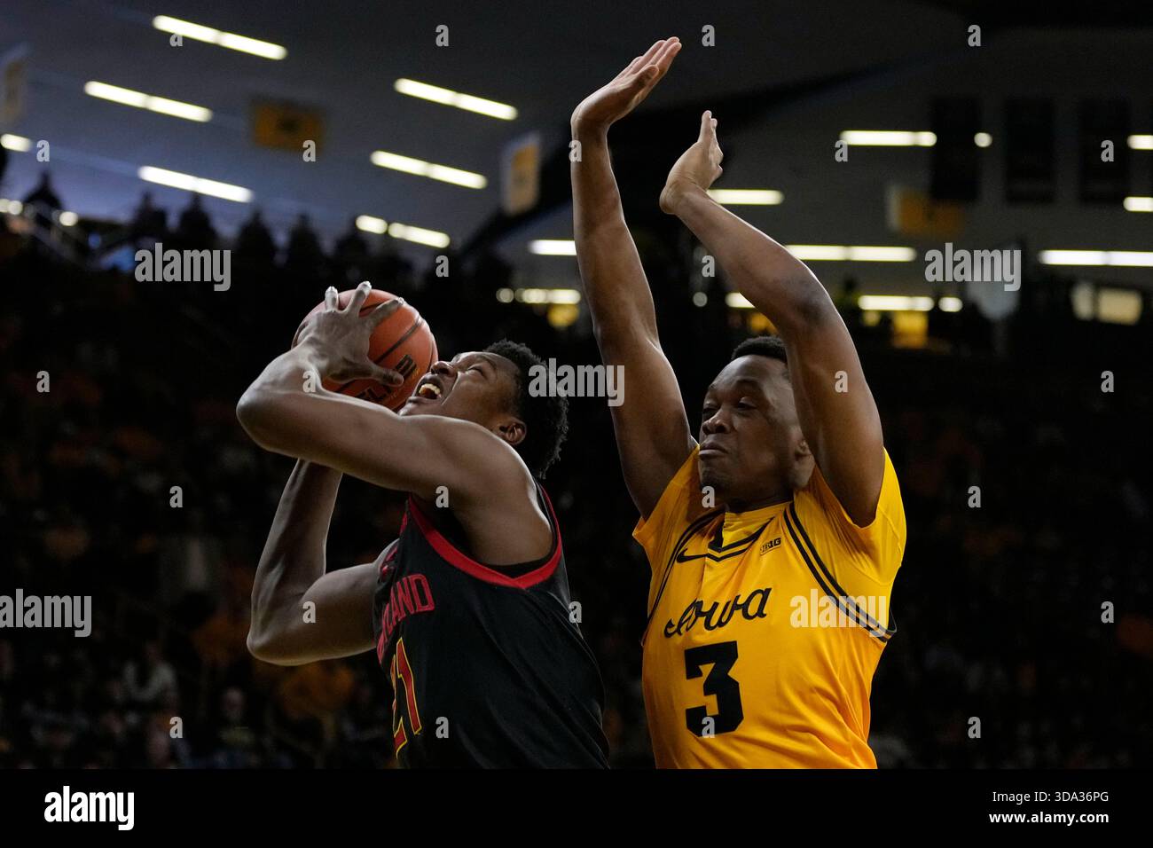 Maryland forward Pharrel Payne (21) drives to the basket past Iowa ...