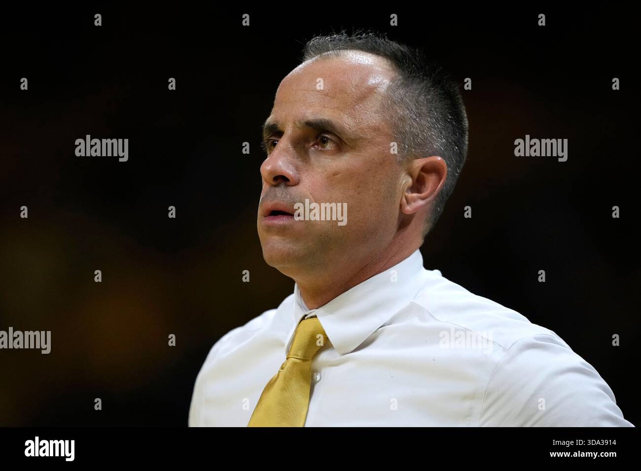 Iowa head coach Ben McCollum watches from the bench during the first ...