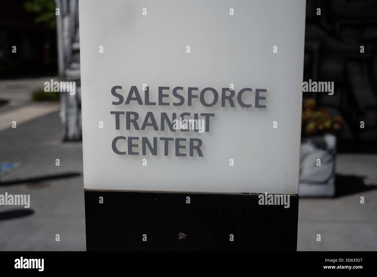 Salesforce Transit Center sign on white pillar along sidewalk, San ...