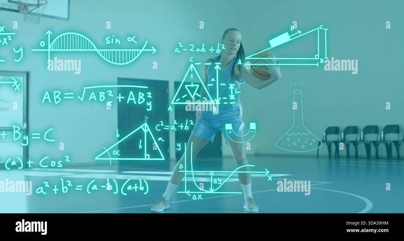 Holding basketball, female player pivoting on gym court, wearing blue ...