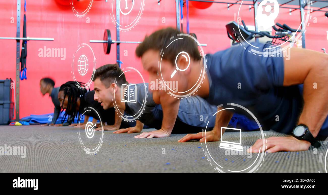 Performing four men doing push-ups in gym wearing athletic clothing ...