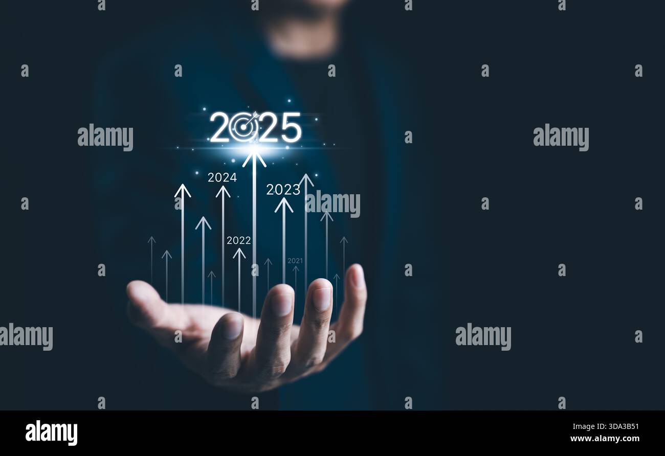Businessman presents the year 2025 with ascending arrows representing ...