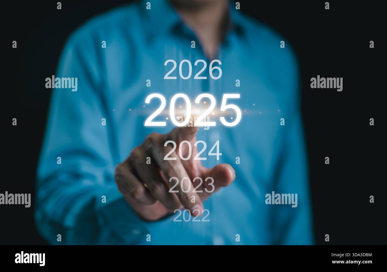 Happy New Year 2025, Businessman points toward the year 2025 on a ...