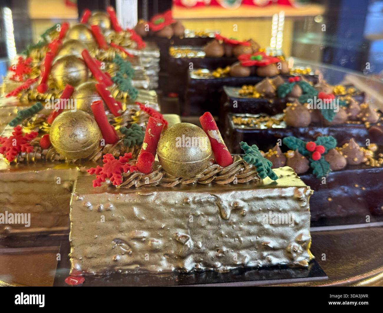 Golden Christmas pastries cake topped with chocolate decorations and ...