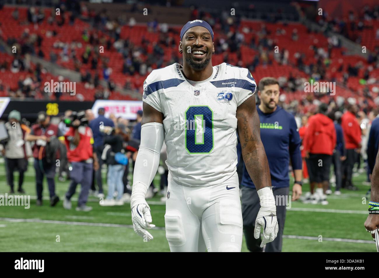 Seattle Seahawks linebacker DeMarcus Lawrence (0) walks off the field ...