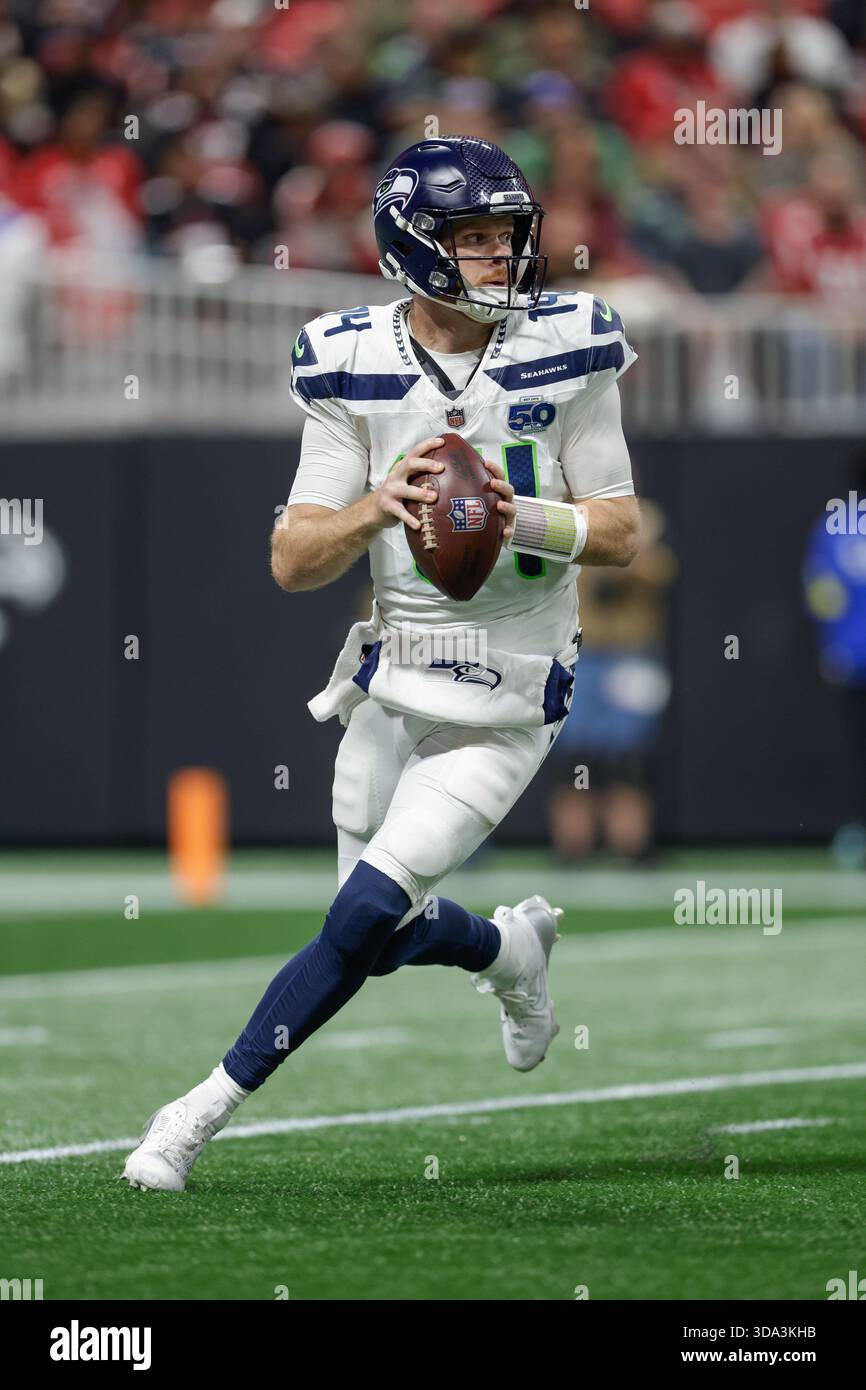 Seattle Seahawks quarterback Sam Darnold (14) runs with the ball during ...