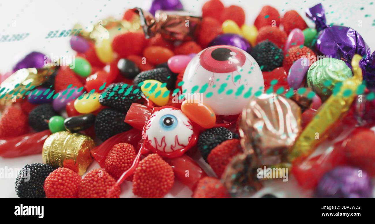 Displaying centered pile of candies on white table, showing eyeball ...