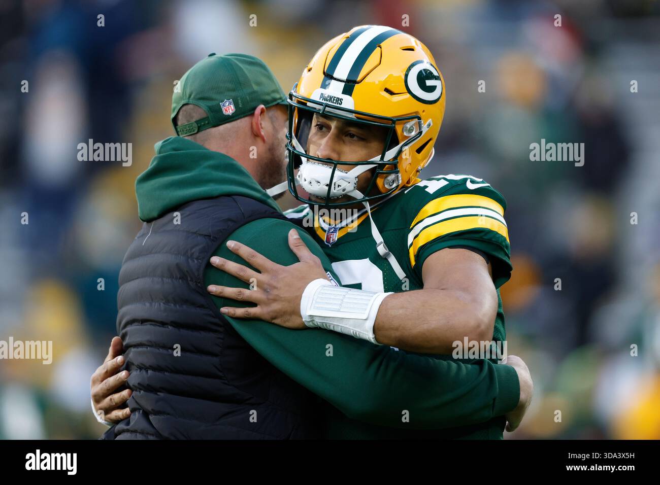Green Bay Packers quarterback Jordan Love (10) gets a hug before an NFL ...