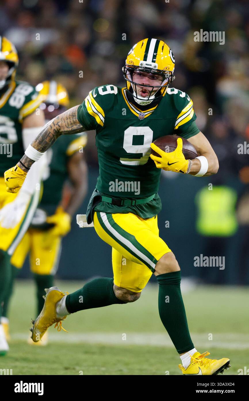 Green Bay Packers wide receiver Christian Watson (9) runs after a catch ...