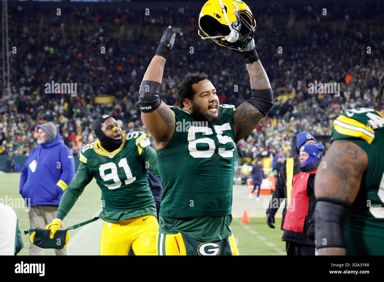 Green Bay Packers guard Aaron Banks (65) walks off the field after an ...