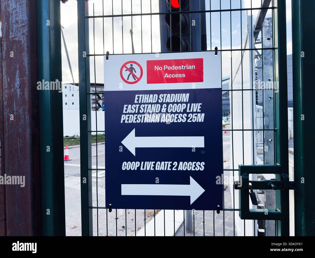 Manchester, UK - November 16, 2025: Signage on a metal gate directing ...