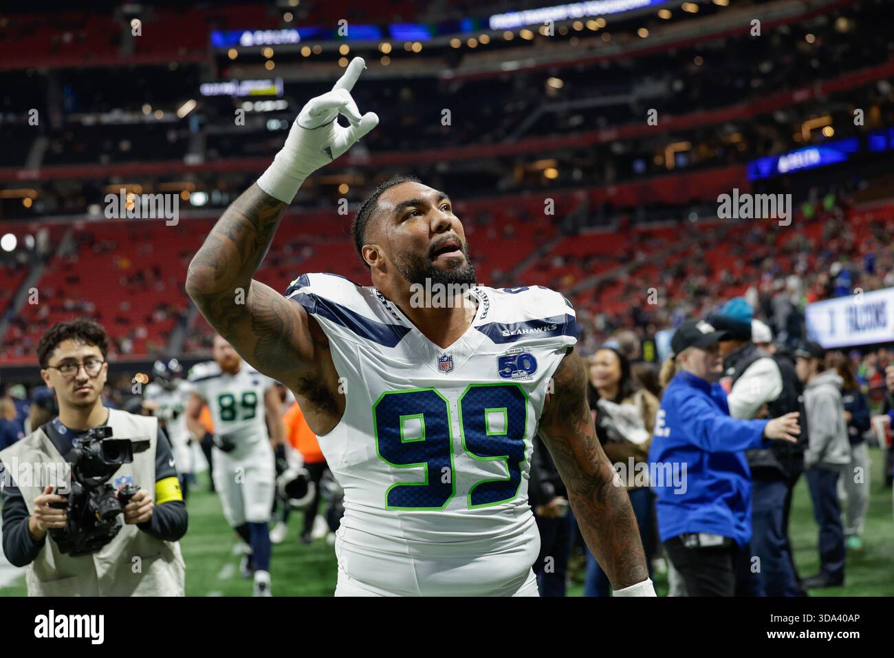 Seattle Seahawks defensive end Leonard Williams (99) waves to the crowd ...