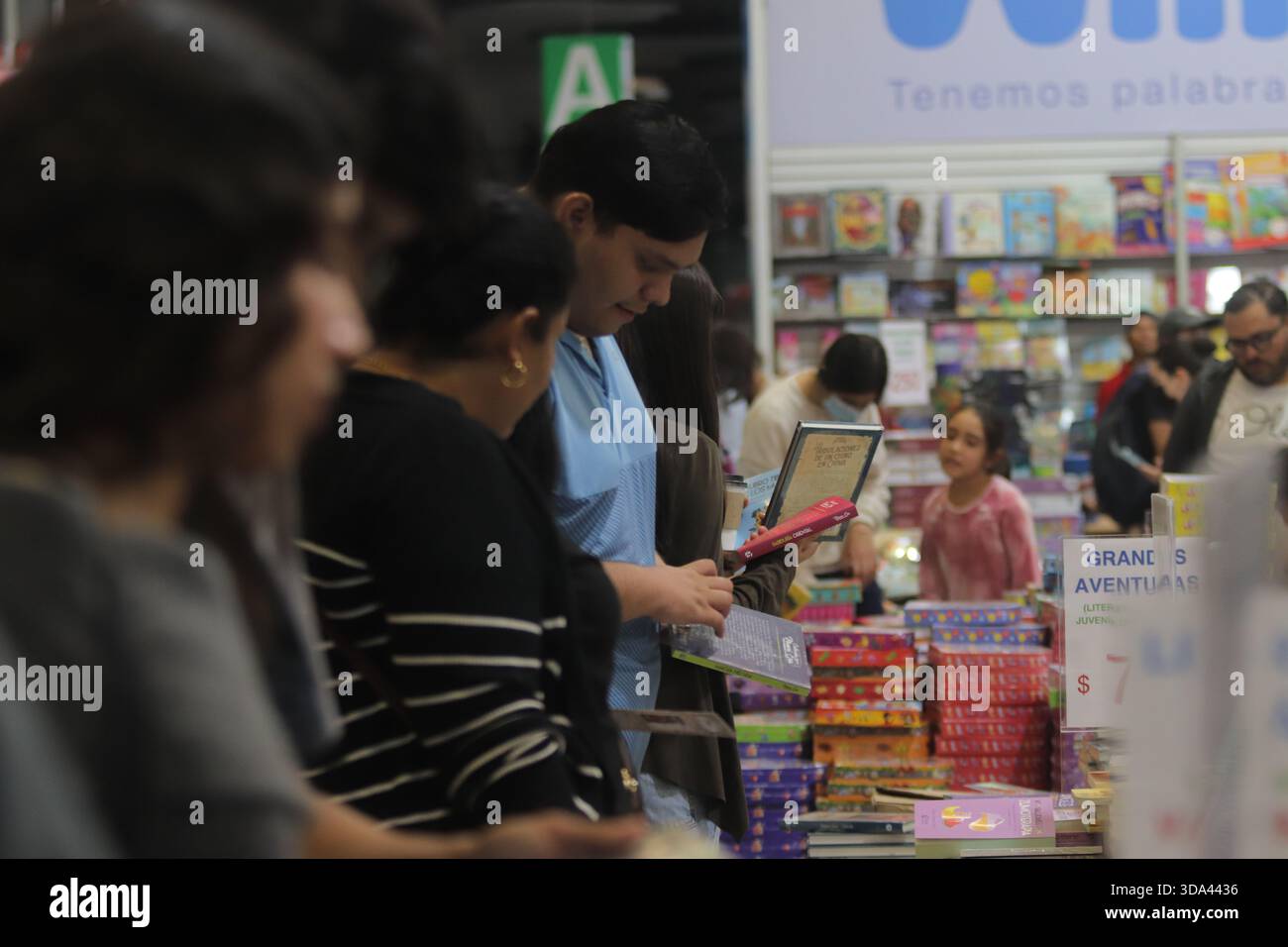 A man reeds a book during the 39th Guadalajara International Book Fair ...