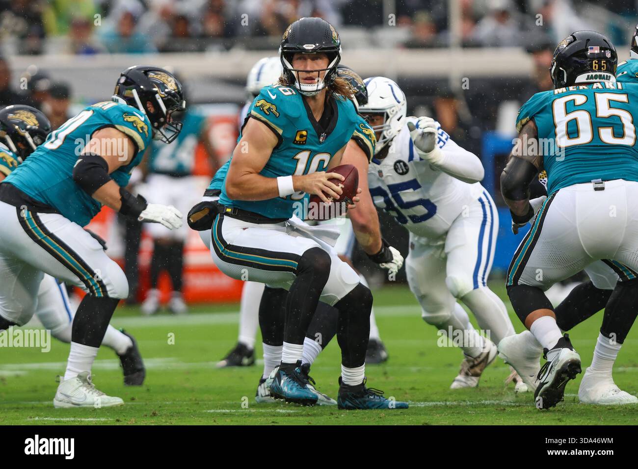 Jacksonville Jaguars quarterback Trevor Lawrence (16) looks back to ...