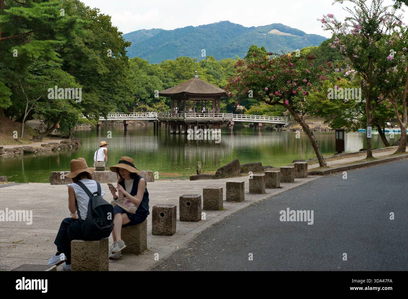Hexagonal-shaped Ukimido Pavilion (浮見堂) in Sagi Pond (鷺池), a refuge in ...