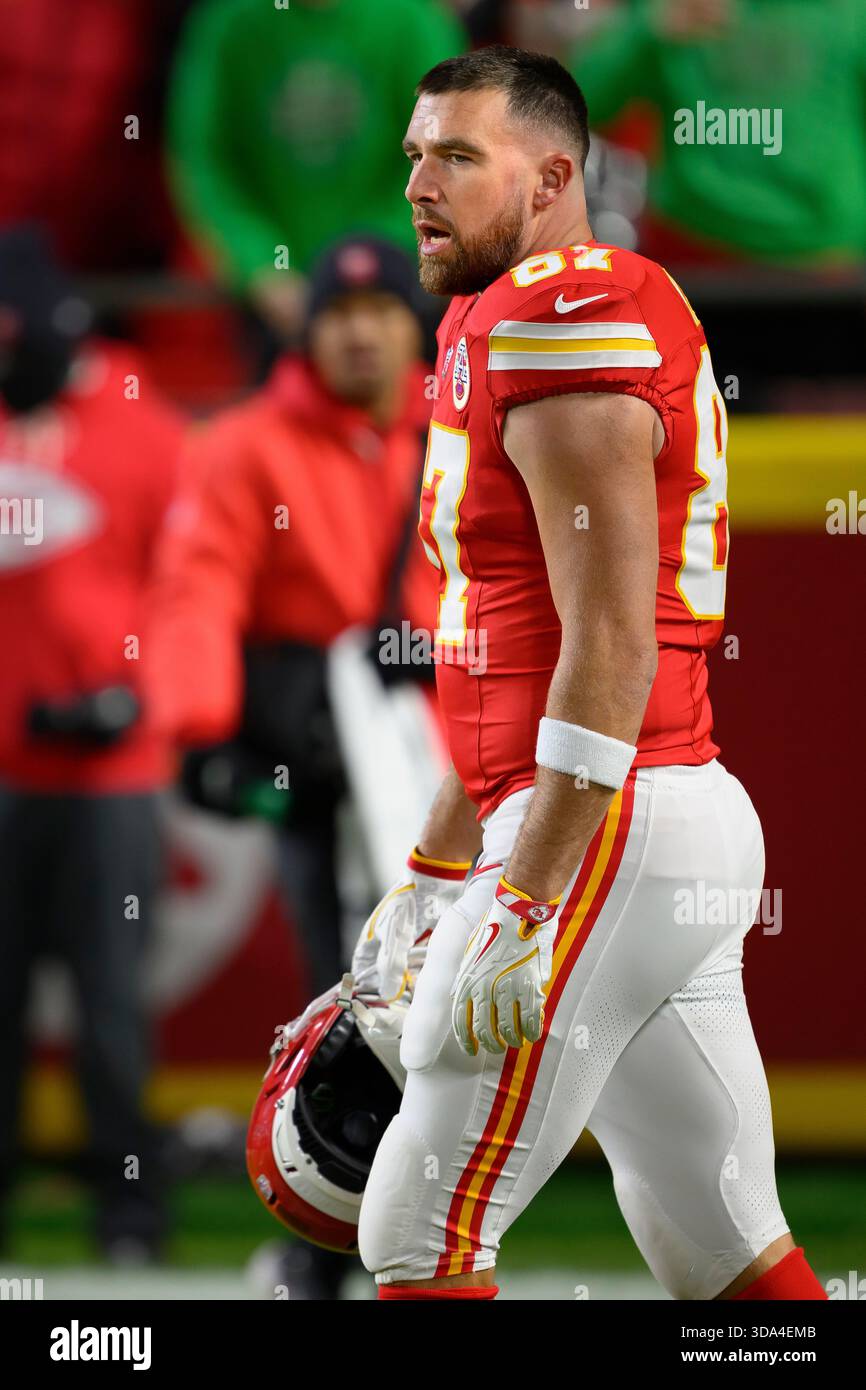 Kansas City Chiefs tight end Travis Kelce removes his helmet between reps during warmups before ...