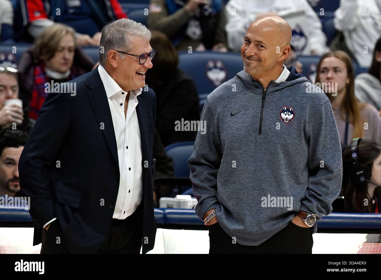 UConn head coach Geno Auriemma shares a light moment with UConn ...