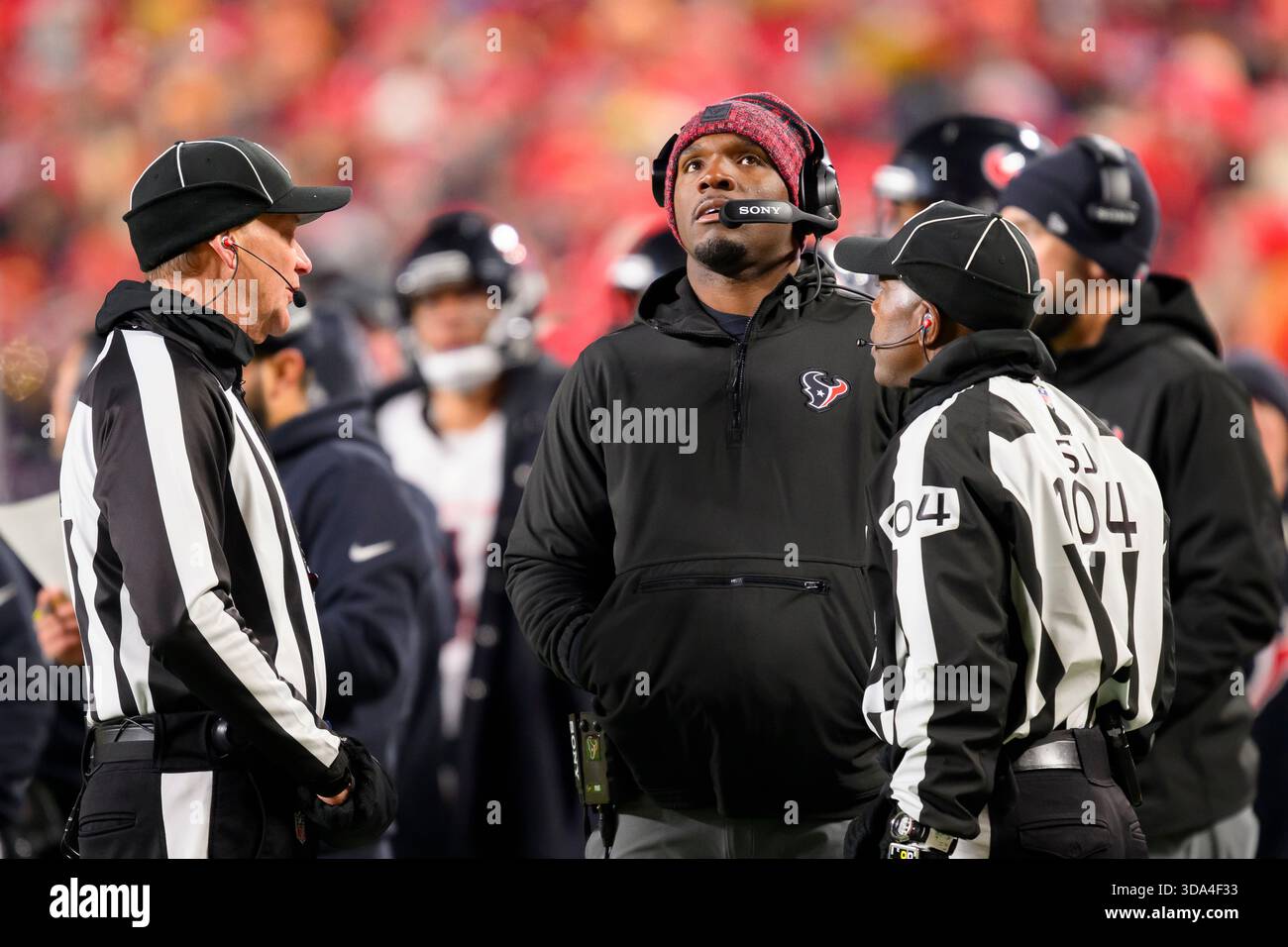 Houston Texans head coach DeMeco Ryans, center, discusses a call with ...