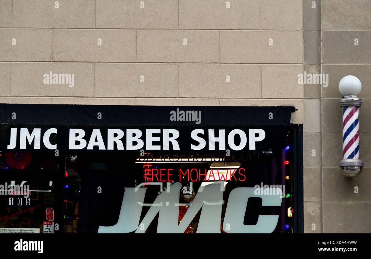 Elmhurst, Illinois, USA. A barber shop window and pole with a whimsical ...