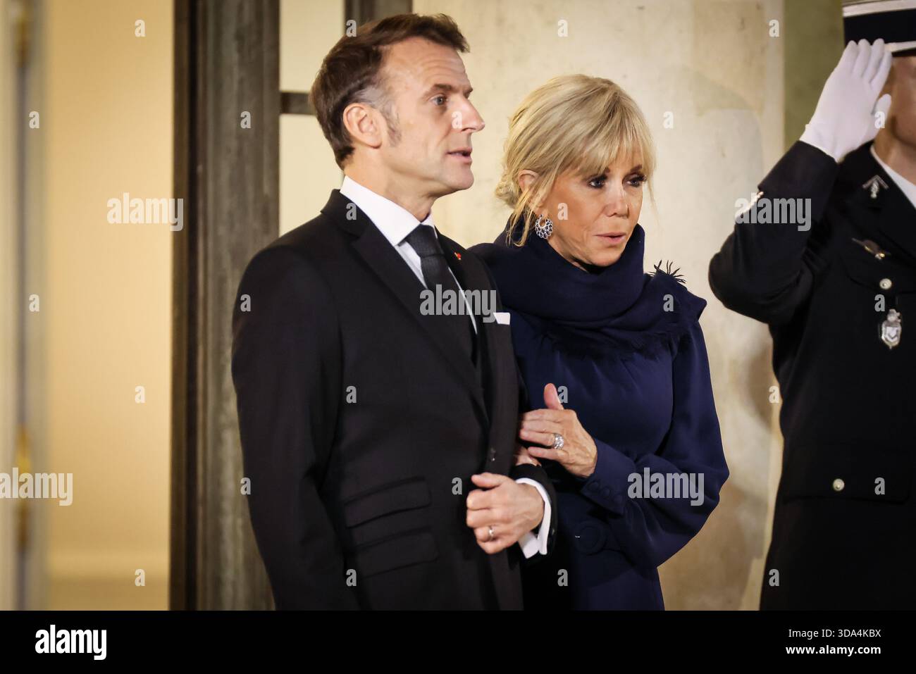 French President Emmanuel Macron and his wife Brigitte Macron wait to ...