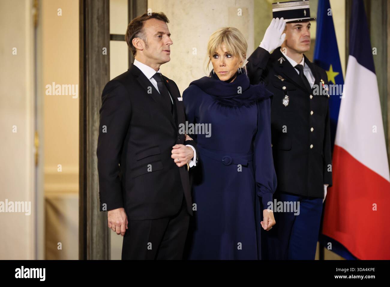 French President Emmanuel Macron and his wife Brigitte Macron wait to ...