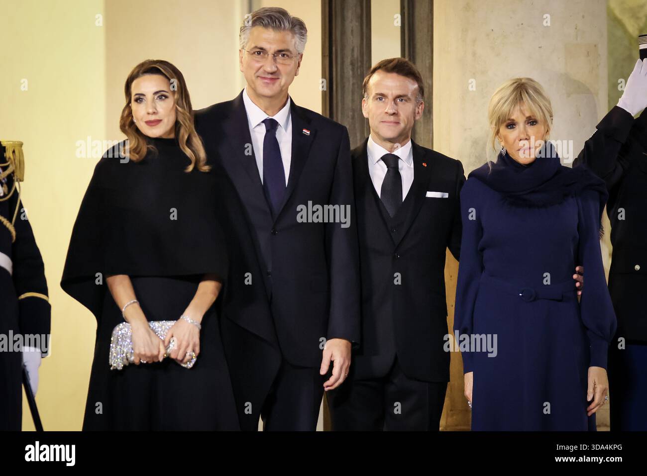 French President Emmanuel Macron, centre right, and his wife Brigitte ...