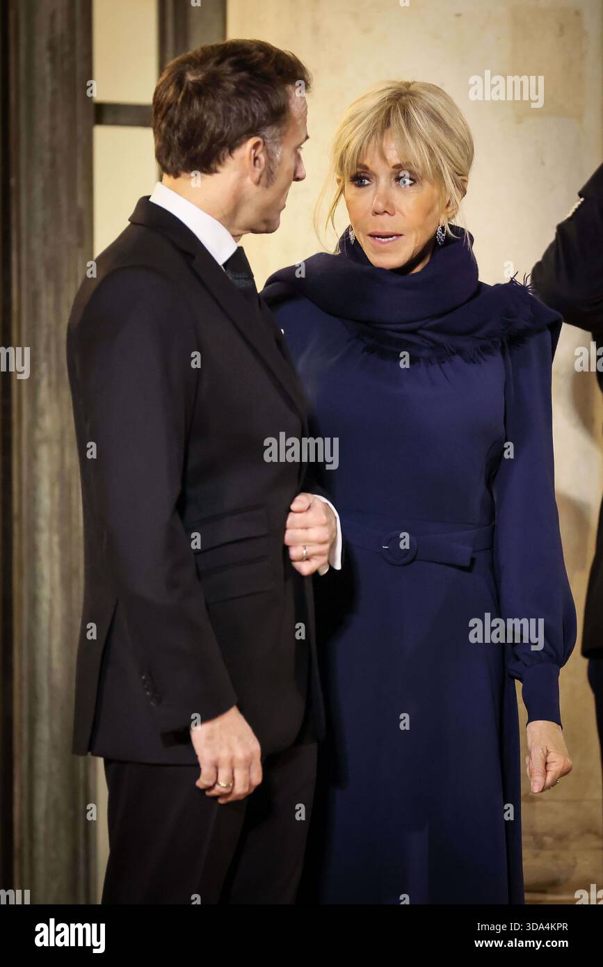 French President Emmanuel Macron and his wife Brigitte Macron wait to ...