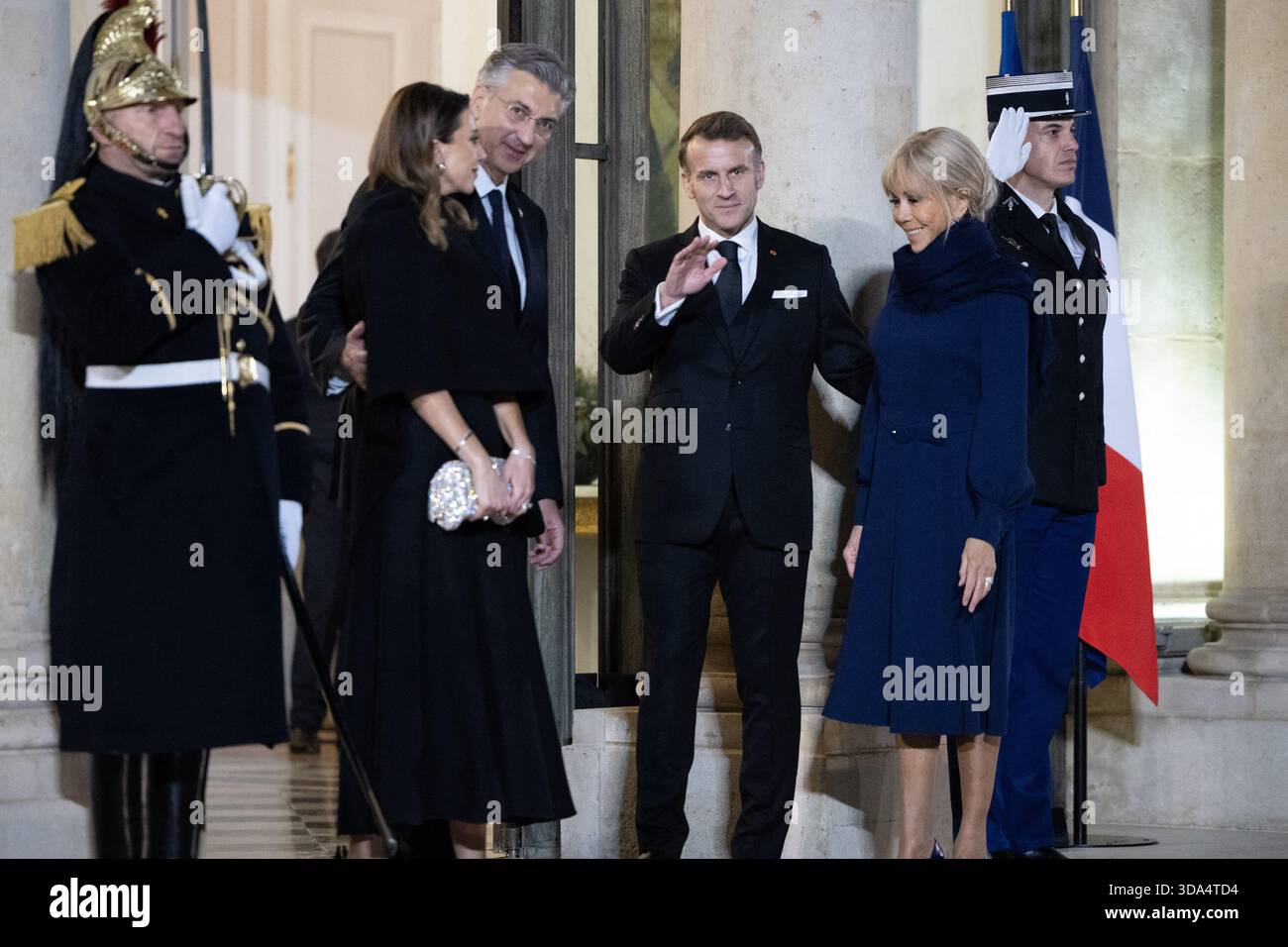 French President Emmanuel Macron and his wife Brigitte Macron welcome ...