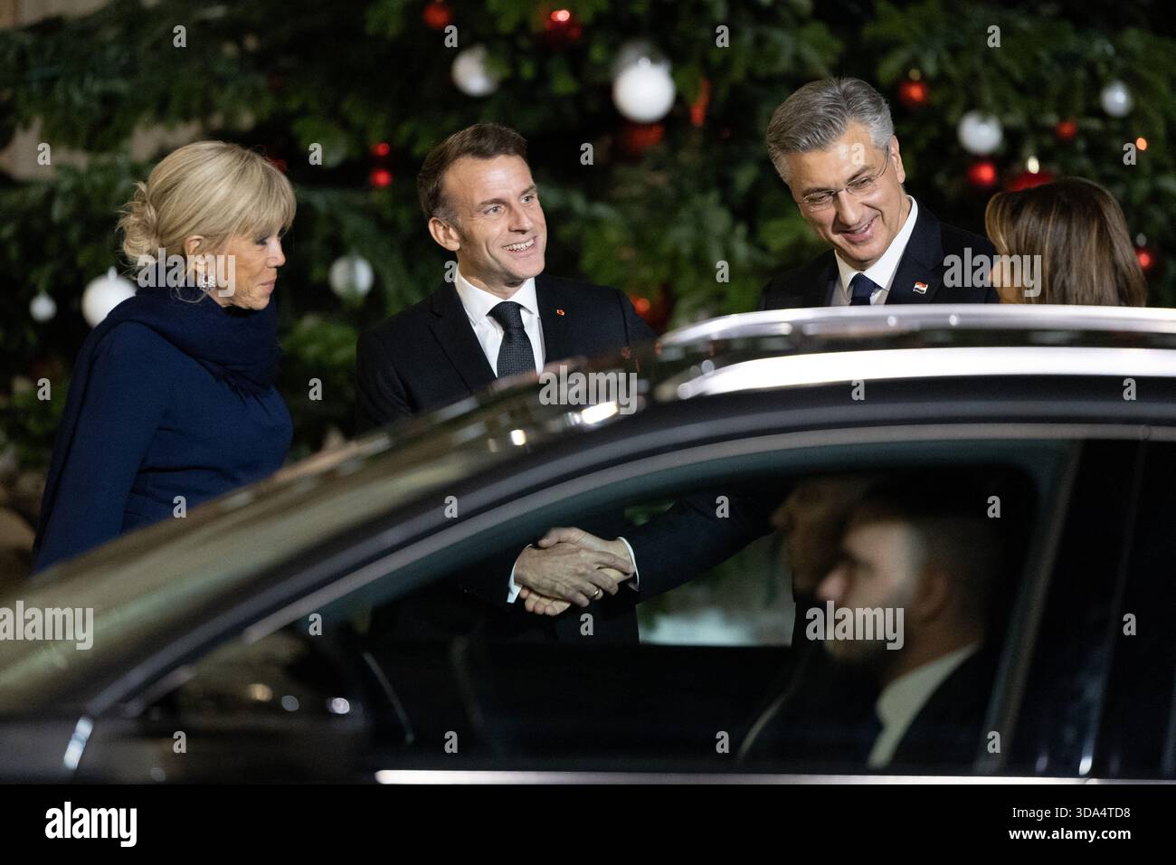 French President Emmanuel Macron and his wife Brigitte Macron welcome ...