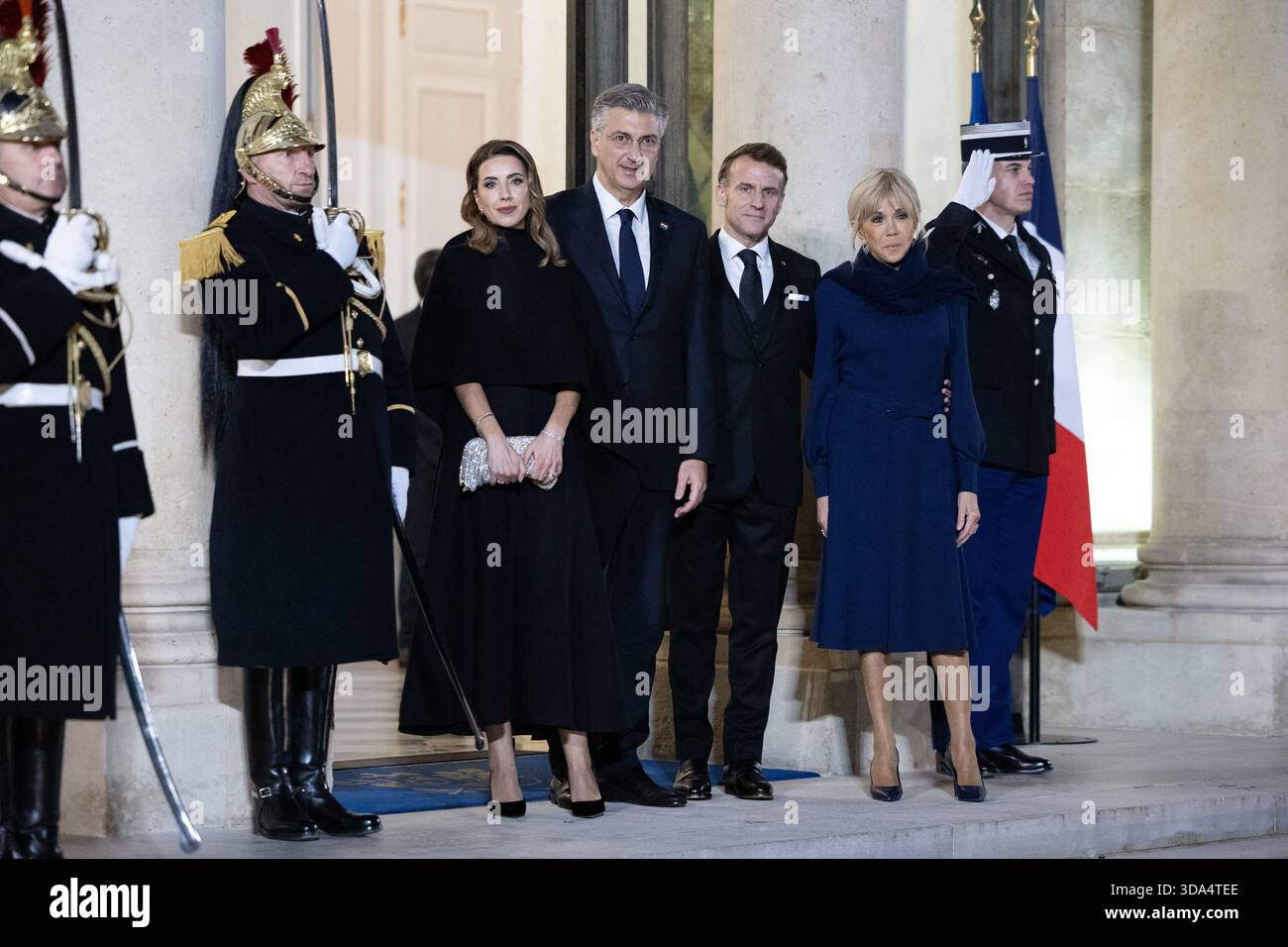 French President Emmanuel Macron and his wife Brigitte Macron welcome ...
