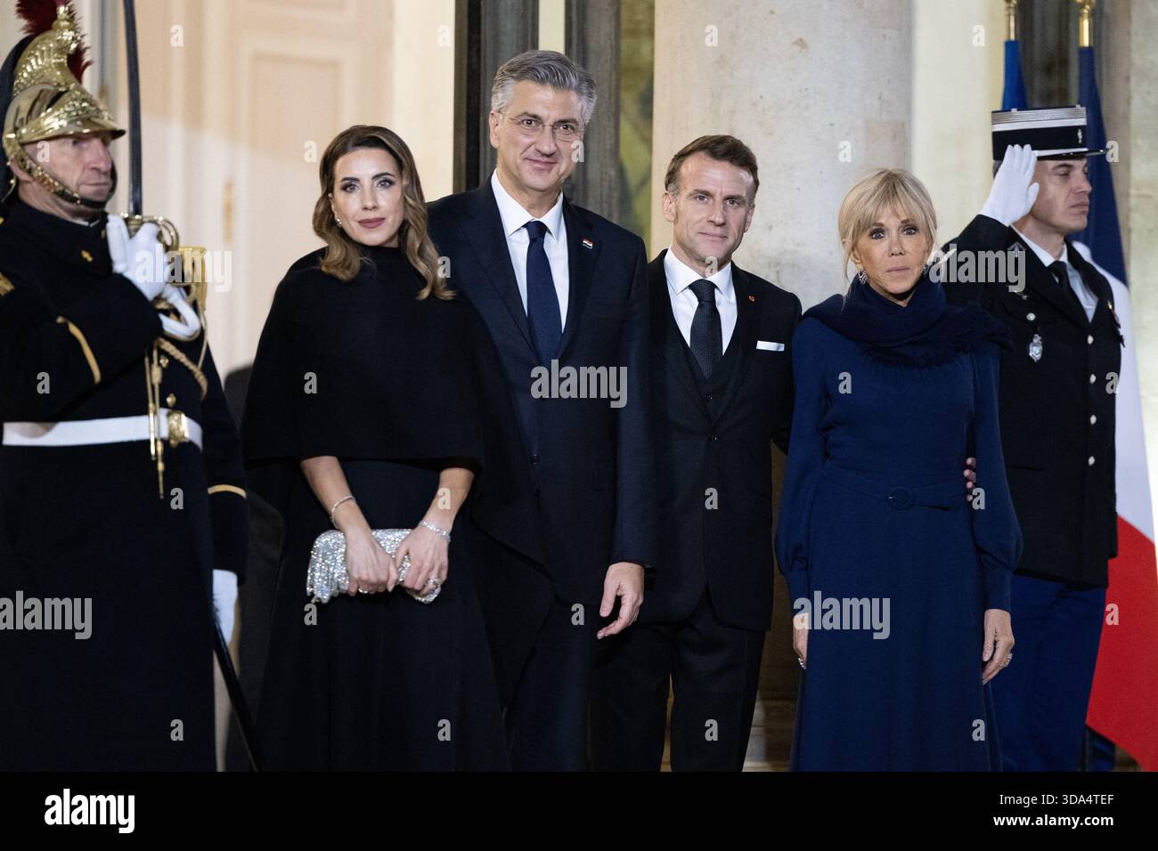 French President Emmanuel Macron and his wife Brigitte Macron welcome ...