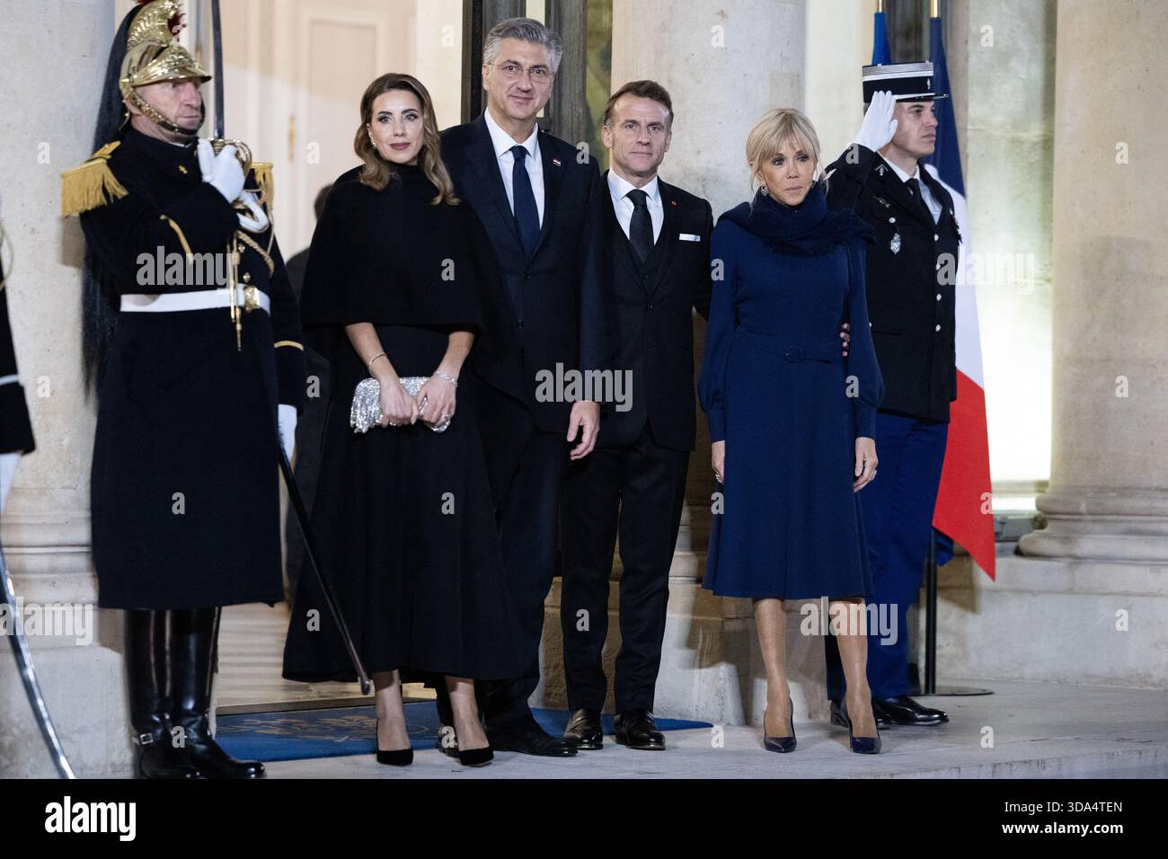 French President Emmanuel Macron and his wife Brigitte Macron welcome ...