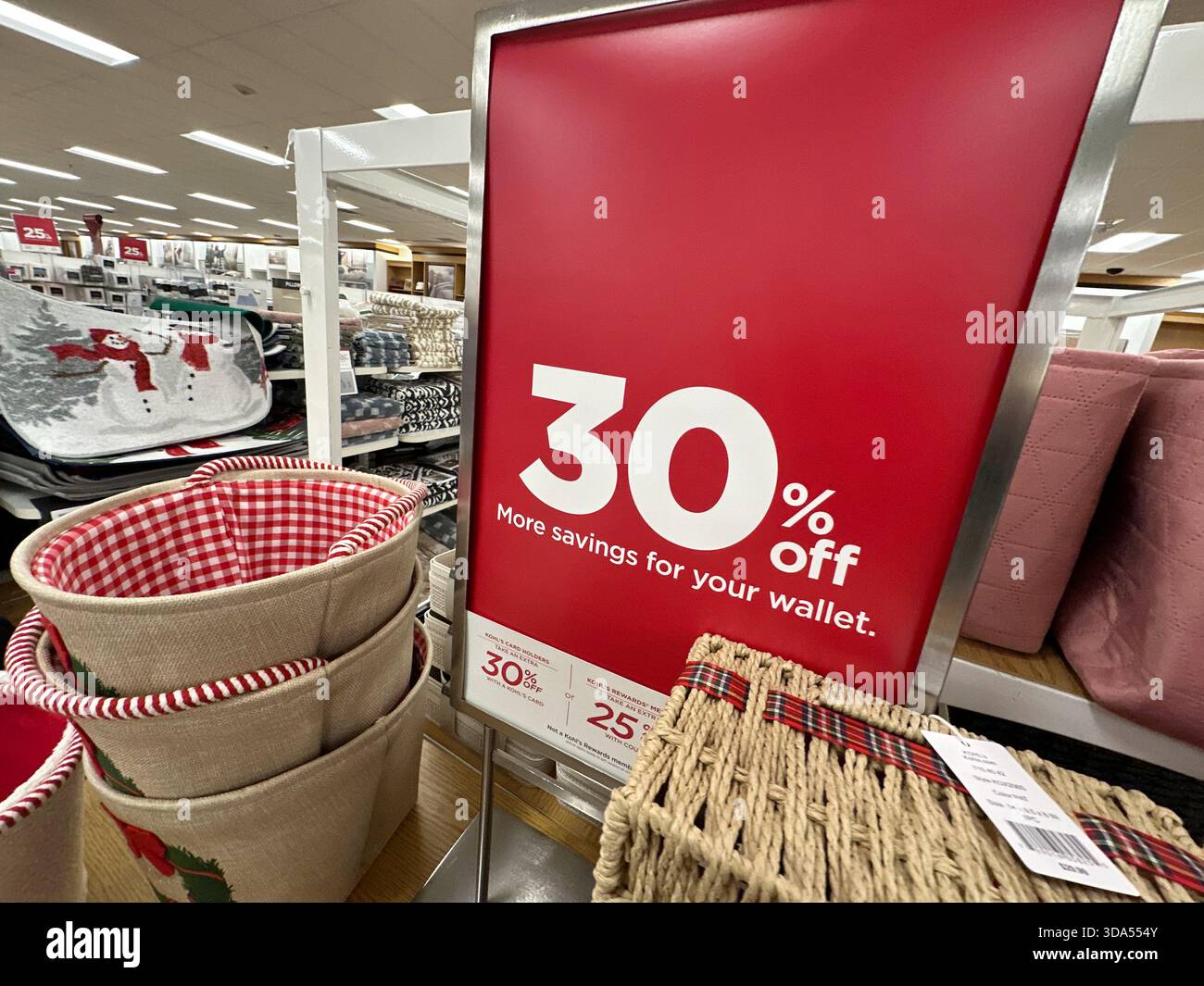 Sign shows discount available on seasonal items in a Kohl's department ...