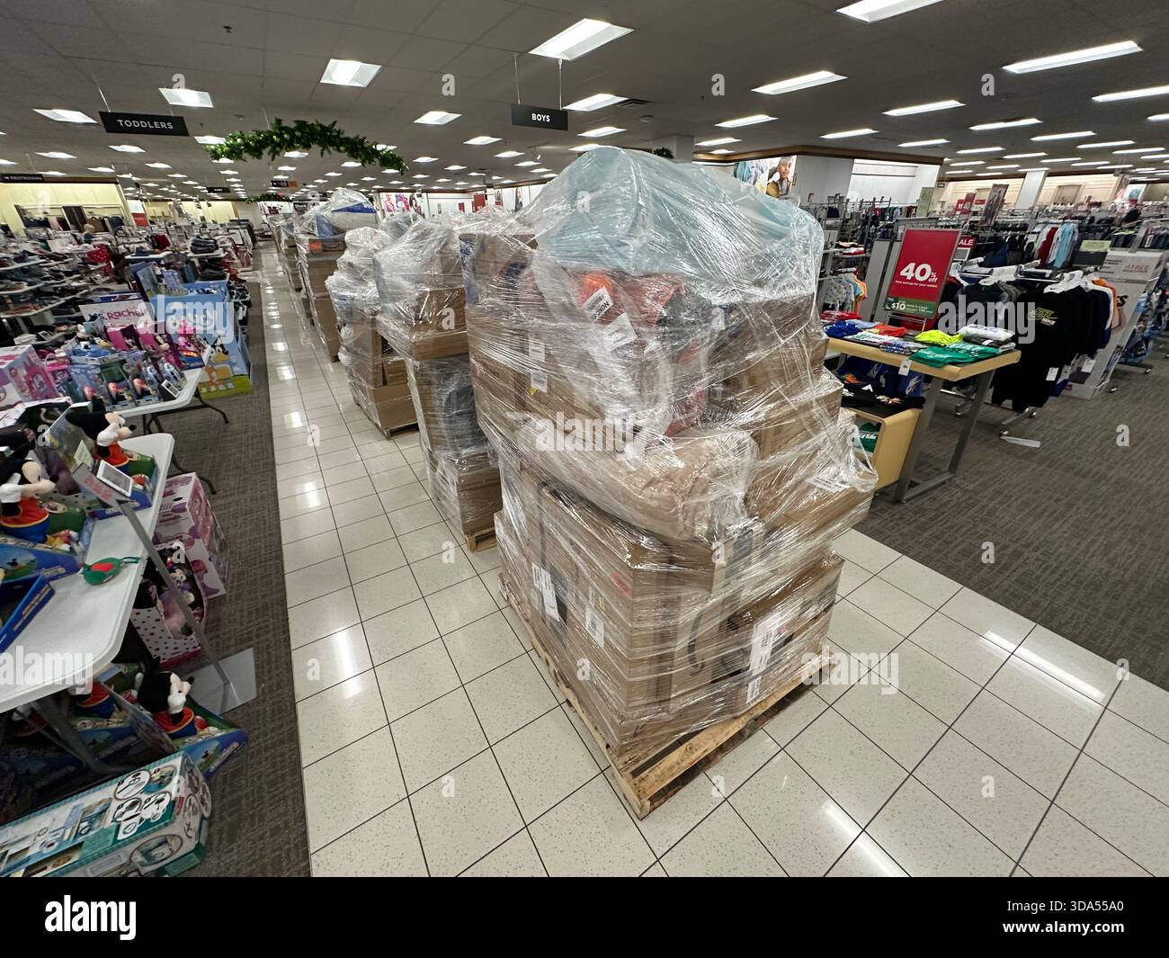 Items wait to be stocked on shelves in a Kohl's department store ...