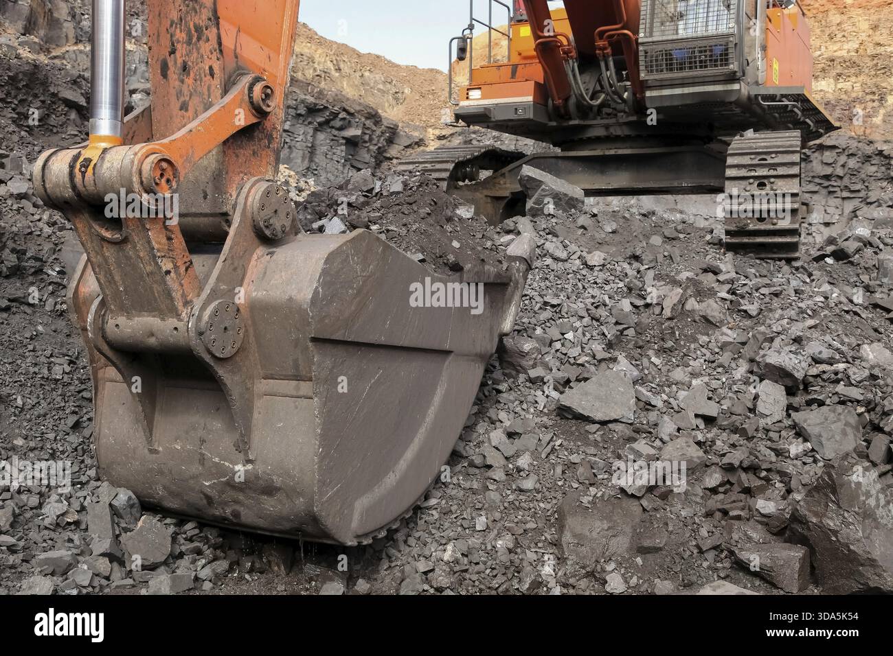 Open pit Manganese Mining - Excavator digging out ore rich rock and ...