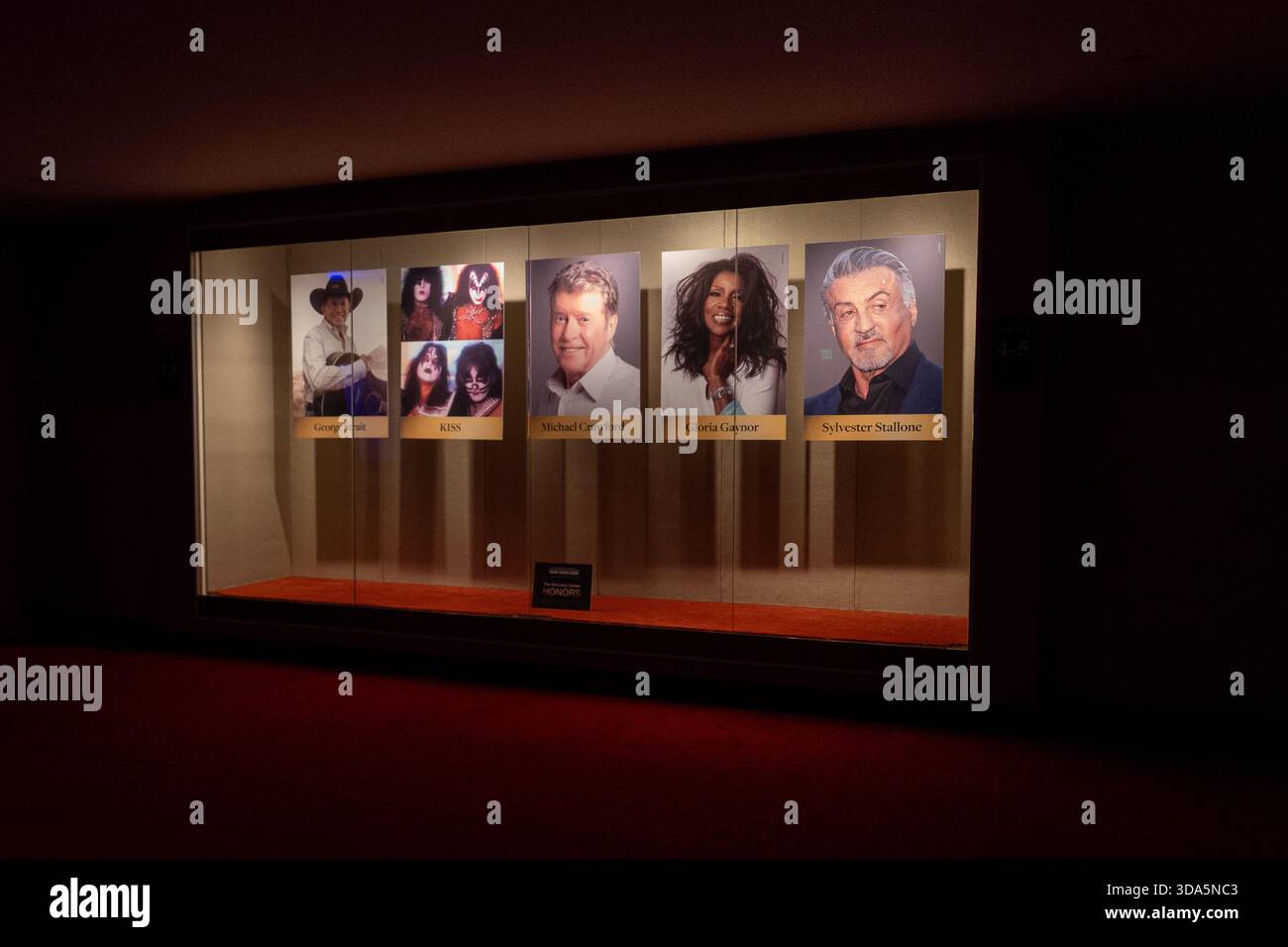 A display shows Sylvester Stallone, George Strait, Kiss, Gloria Gaynor ...