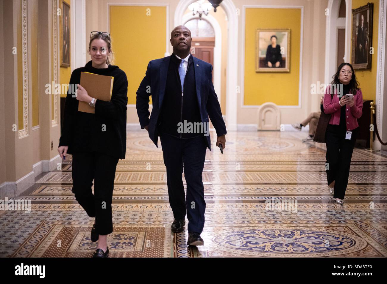 Sen. Tim Scott (R-S.C.) walks to a meeting at the U.S. Capitol Dec. 8 ...