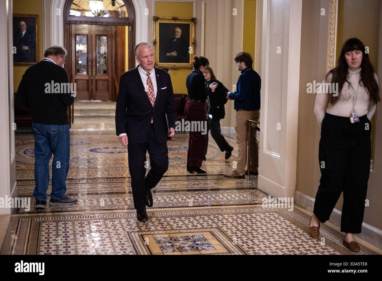 Sen. Dan Sullivan (R-Alaska) walks to a meeting at the U.S. Capitol Dec ...