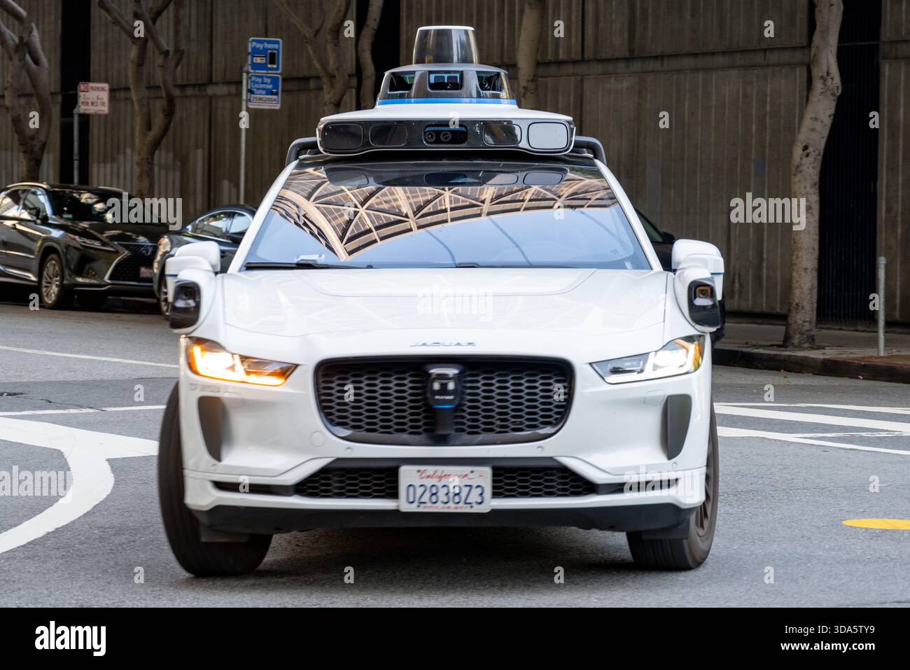 Waymo autonomous Jaguar I-Pace SUV equipped with rooftop lidar and ...