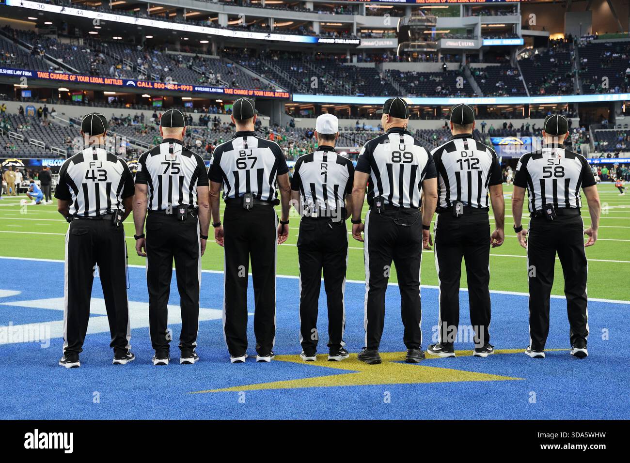 The referee crew including from left, replay official Matt Sumstine ...