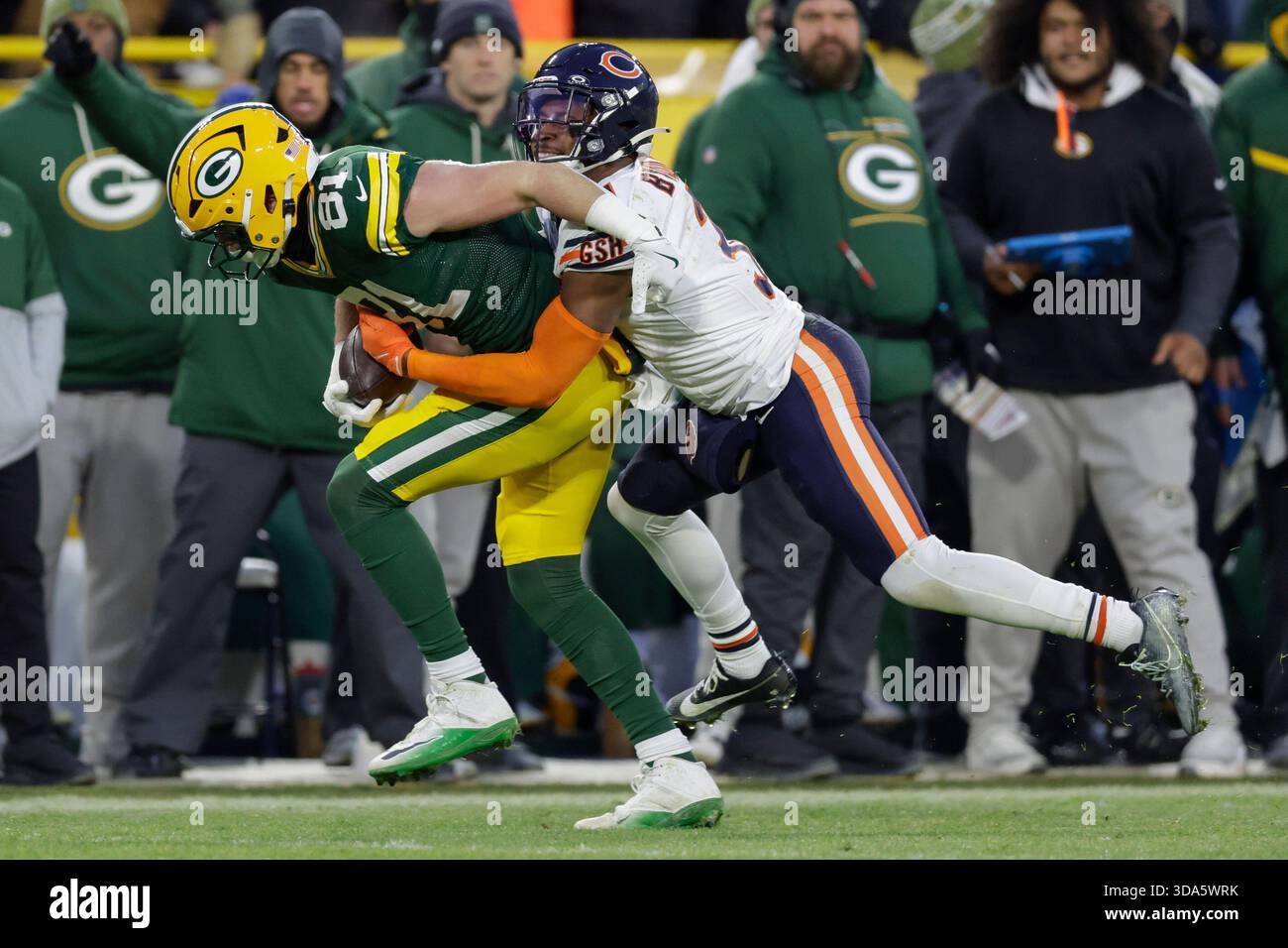 Green Bay Packers tight end Josh Whyle (81) is hit after making a catch ...