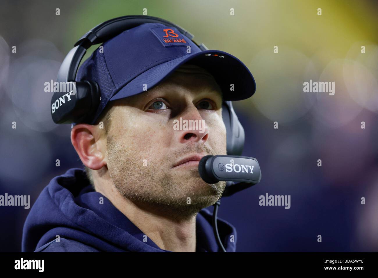 Chicago Bears head coach Ben Johnson looks onto the field during an NFL ...