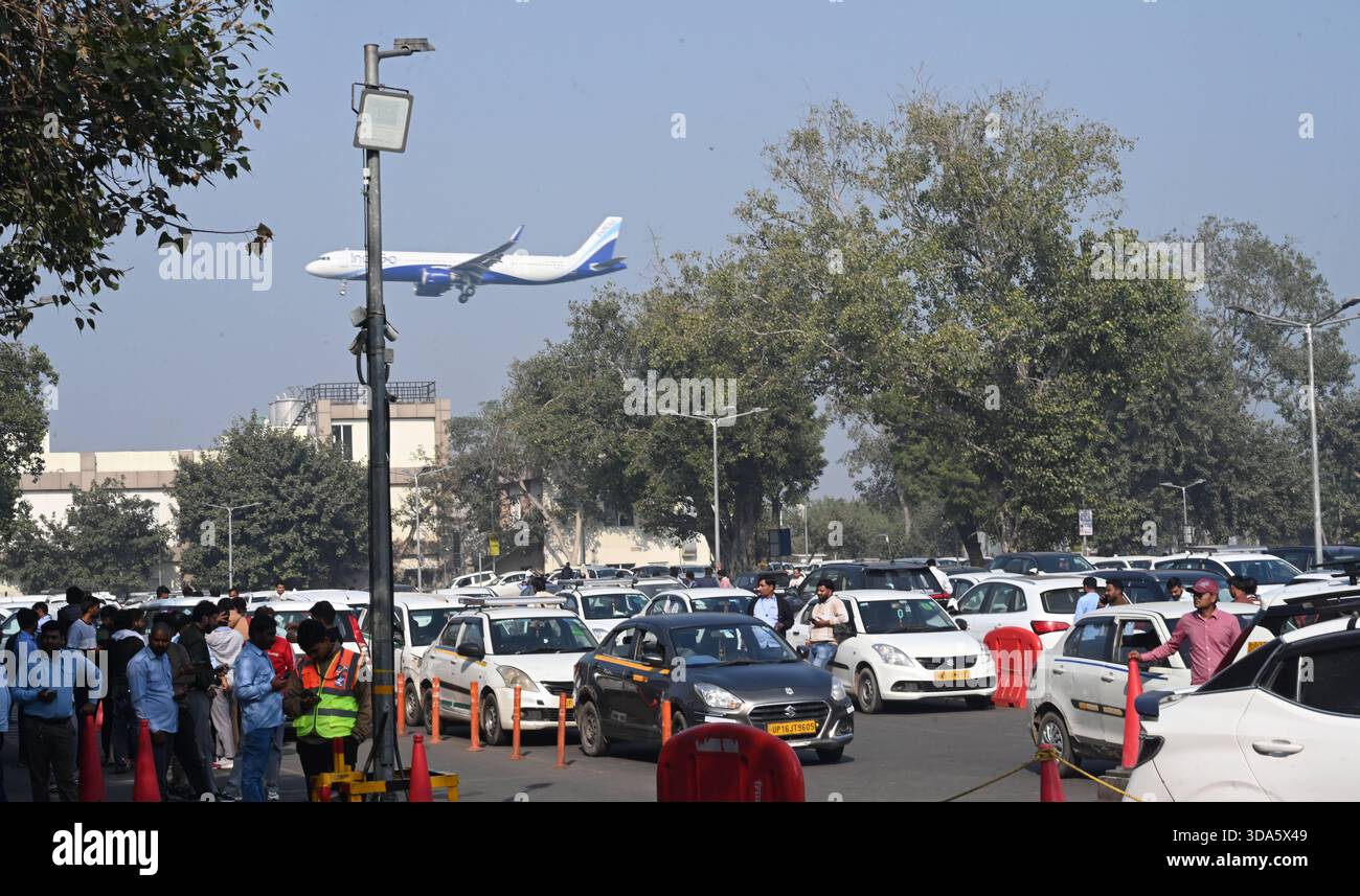 NEW DELHI, INDIA - DECEMBER 8: Ola, Uber and Rapido taxi at Taxi stand ...