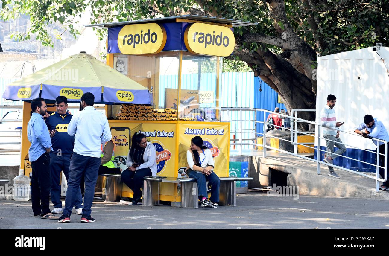 NEW DELHI, INDIA - DECEMBER 8: Rapido Taxi stand at the IGI ...