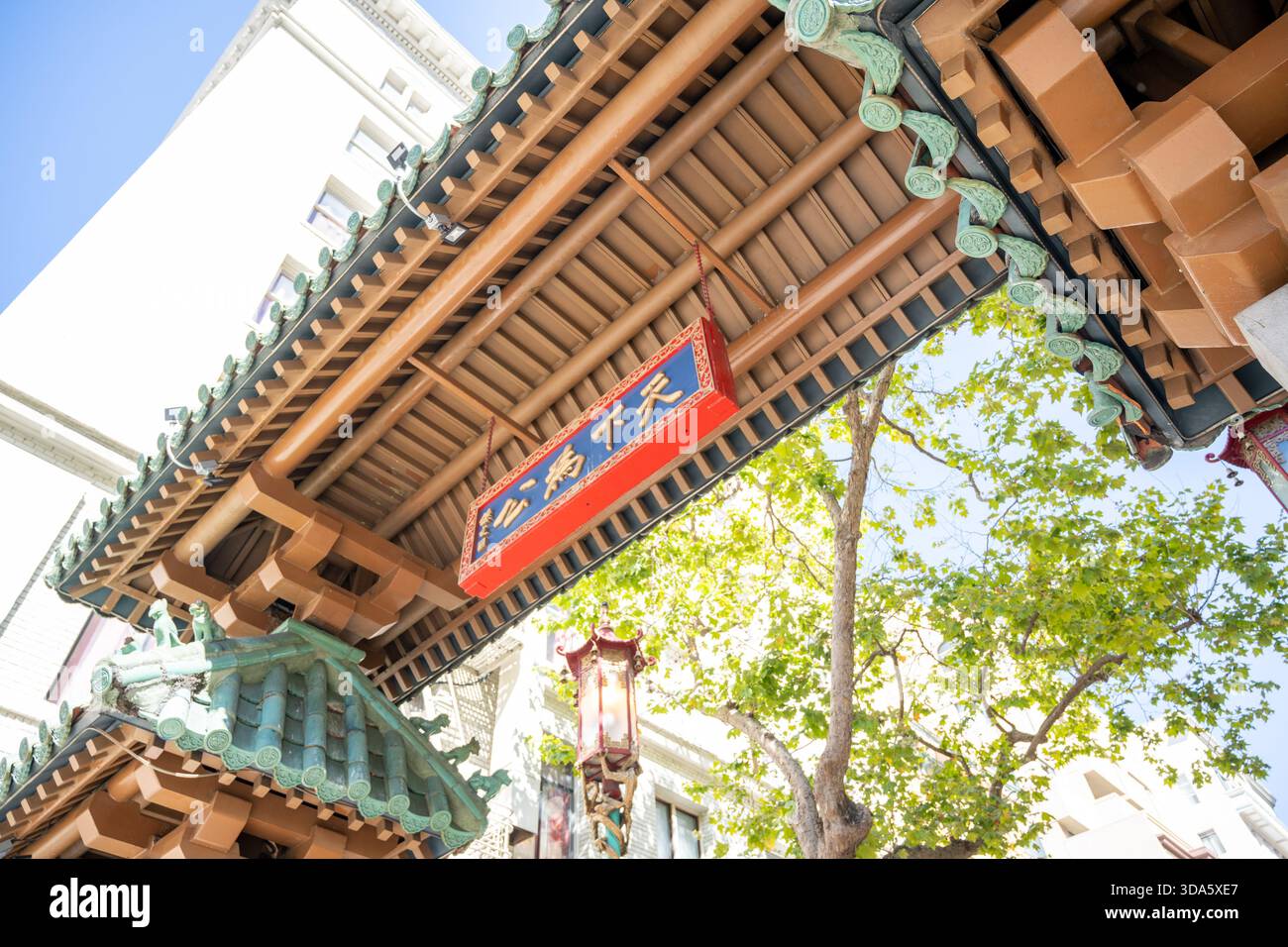 Traditional Chinese-style Dragon Gate gateway with green tiled roof and ...