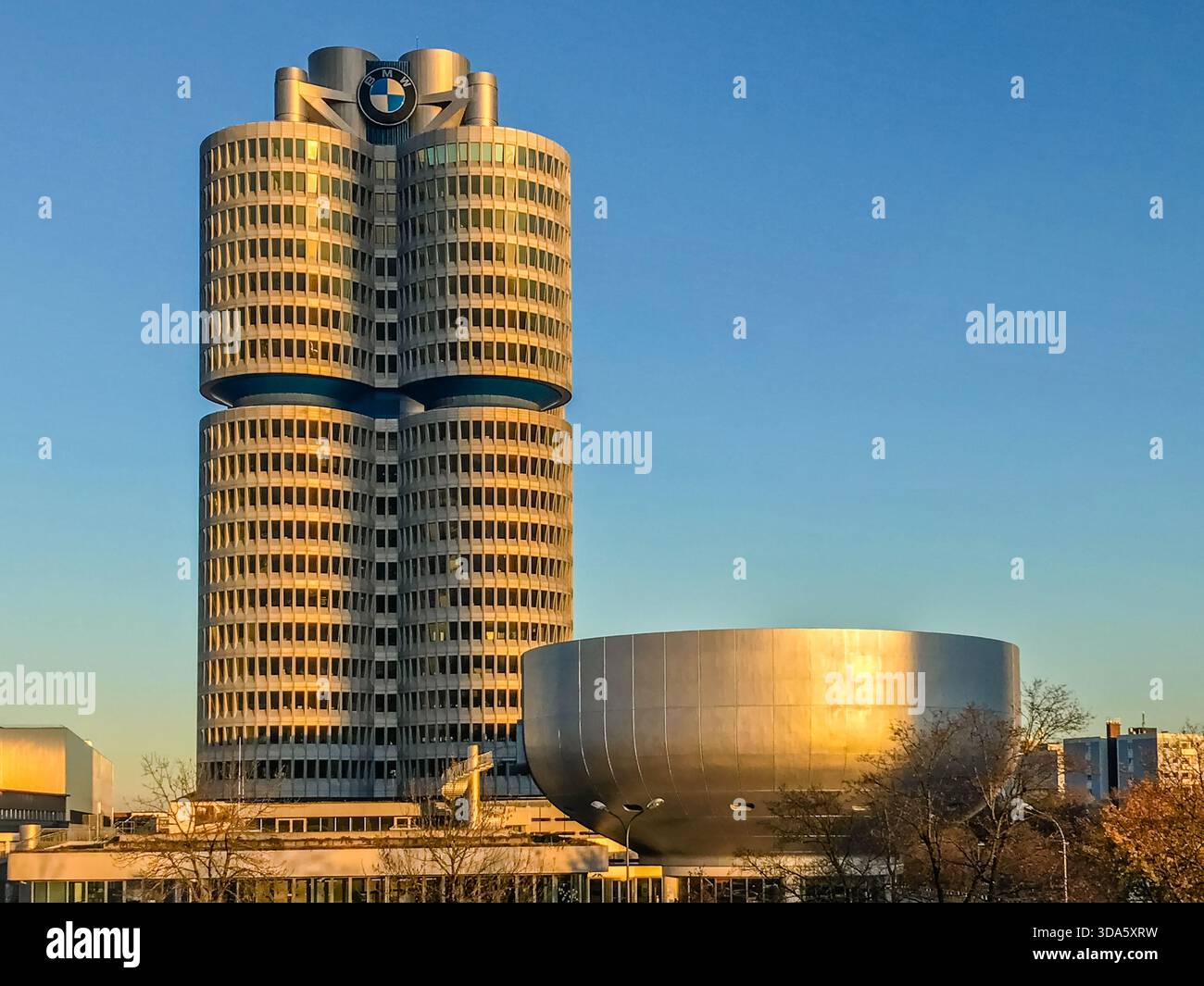 BMW Headquarters and the BMW Museum in Munich at sunset, showing the ...