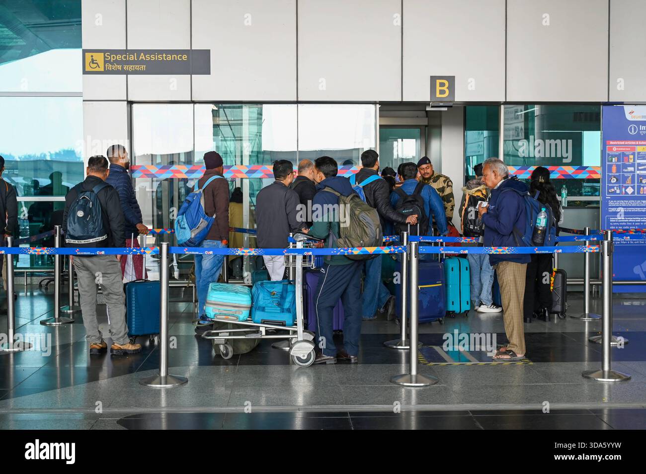 NEW DELHI, INDIA - DECEMBER 8: passangers seen in line at T1 Terminal ...