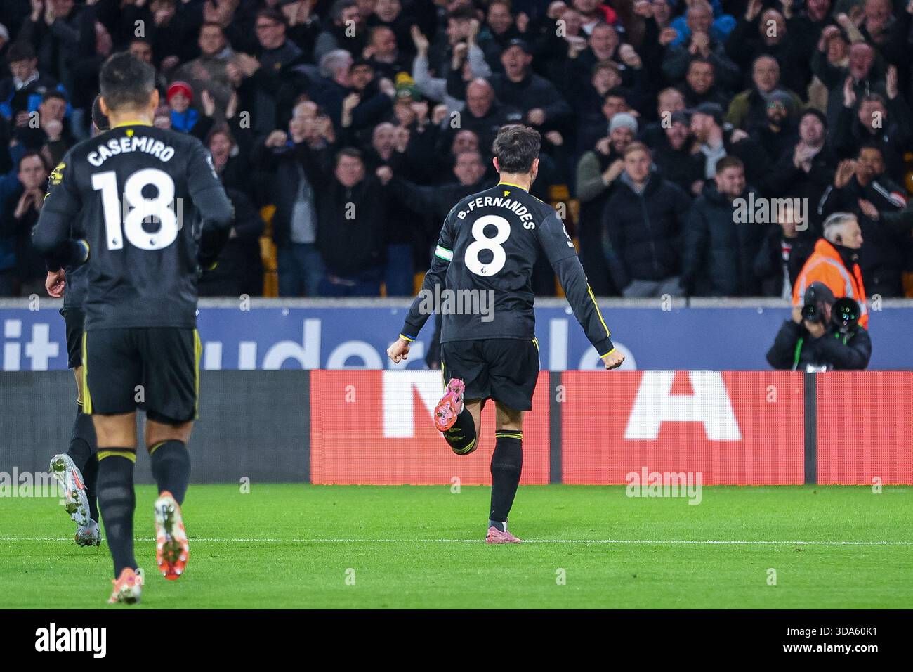 8, Bruno Fernandes of Manchester United races to celebrate the goal in ...