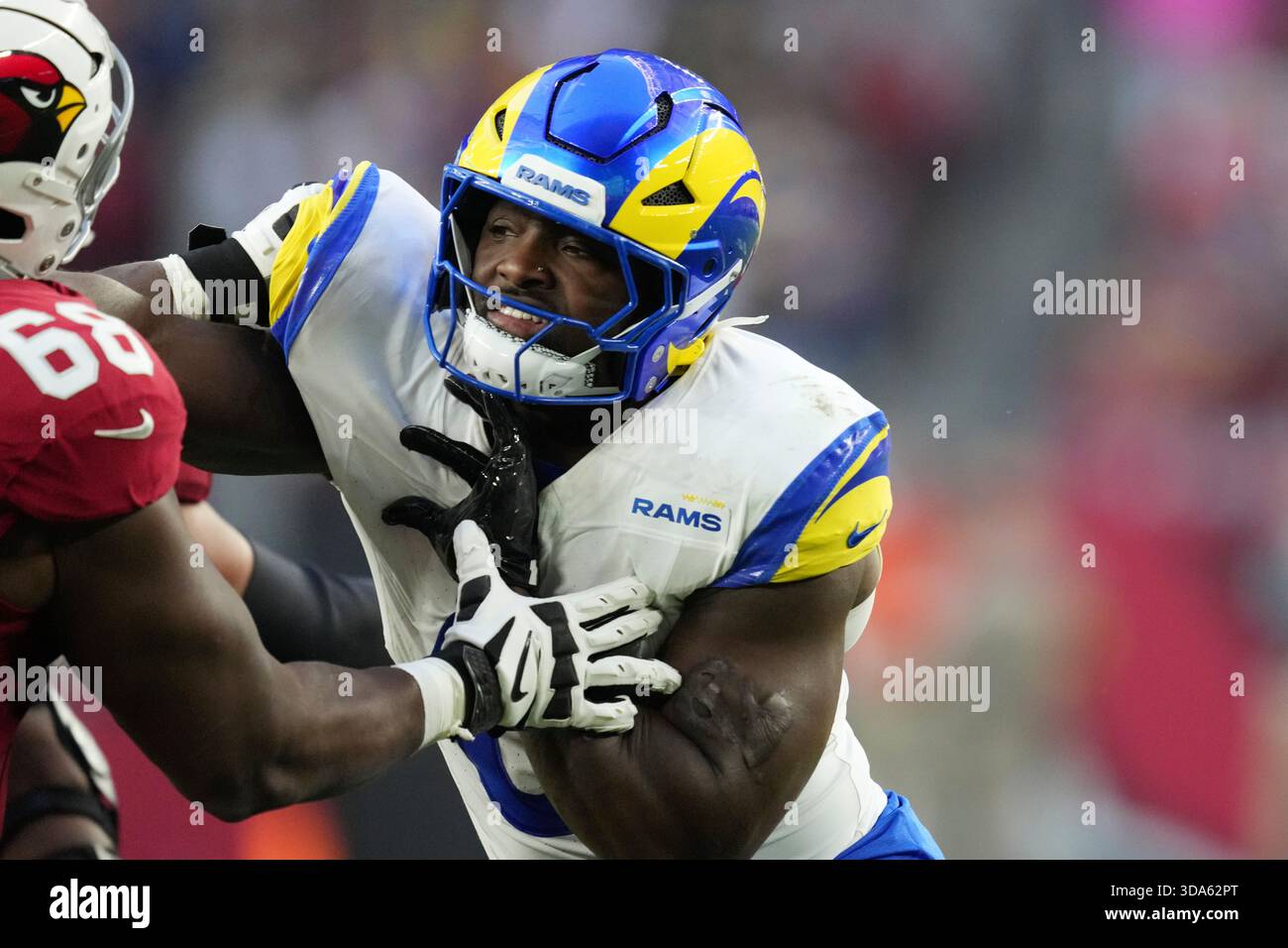 Los Angeles Rams outside linebacker Byron Young, right, tries to get ...