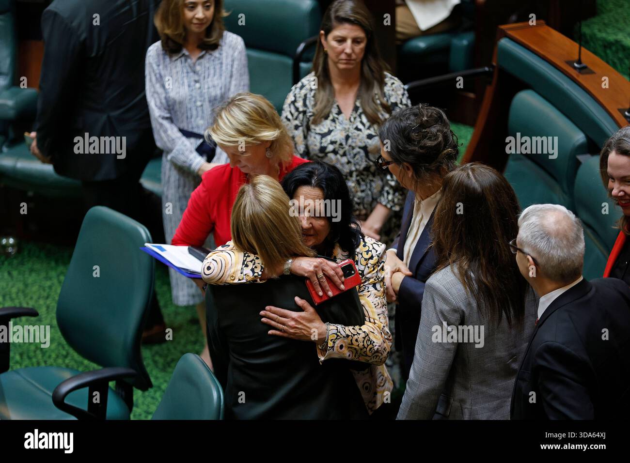 Labour MP Chris Couzens embraces Victorian Premier Jacinta Allan after ...
